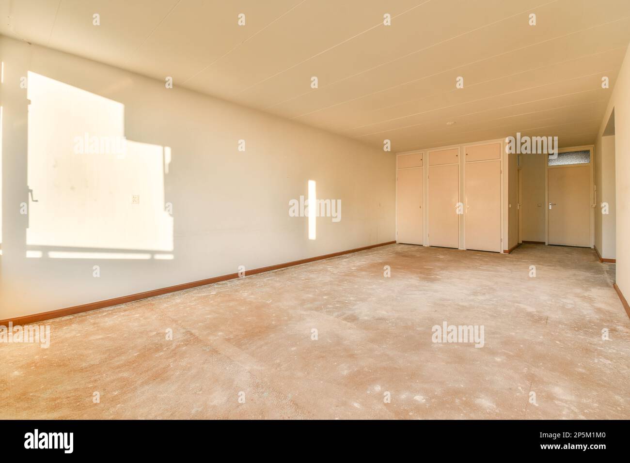 an empty room with white walls and no one person in the room looking at ...
