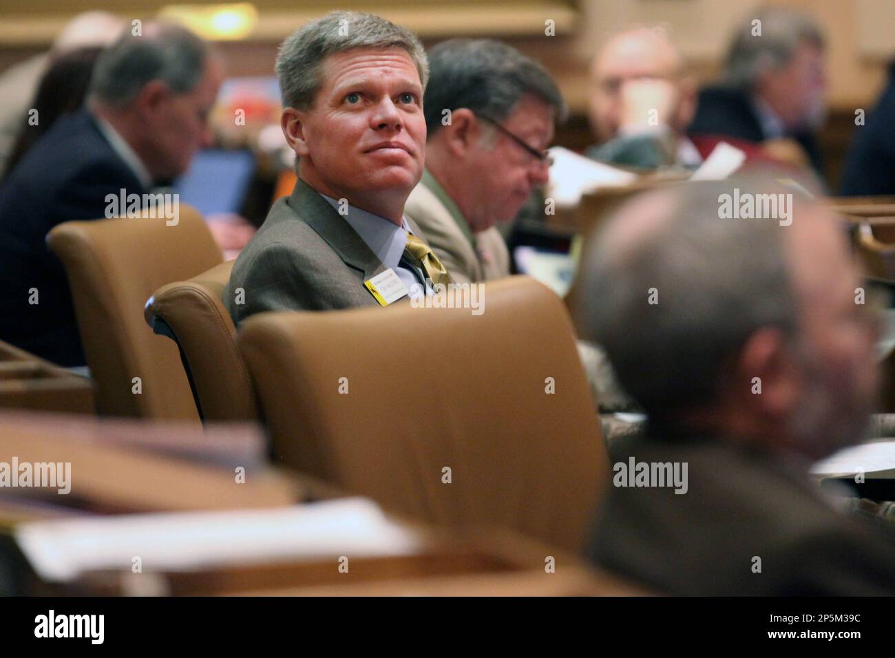 Rep. Tom Walters, R-Casper, looks up at the gallery while listening to ...
