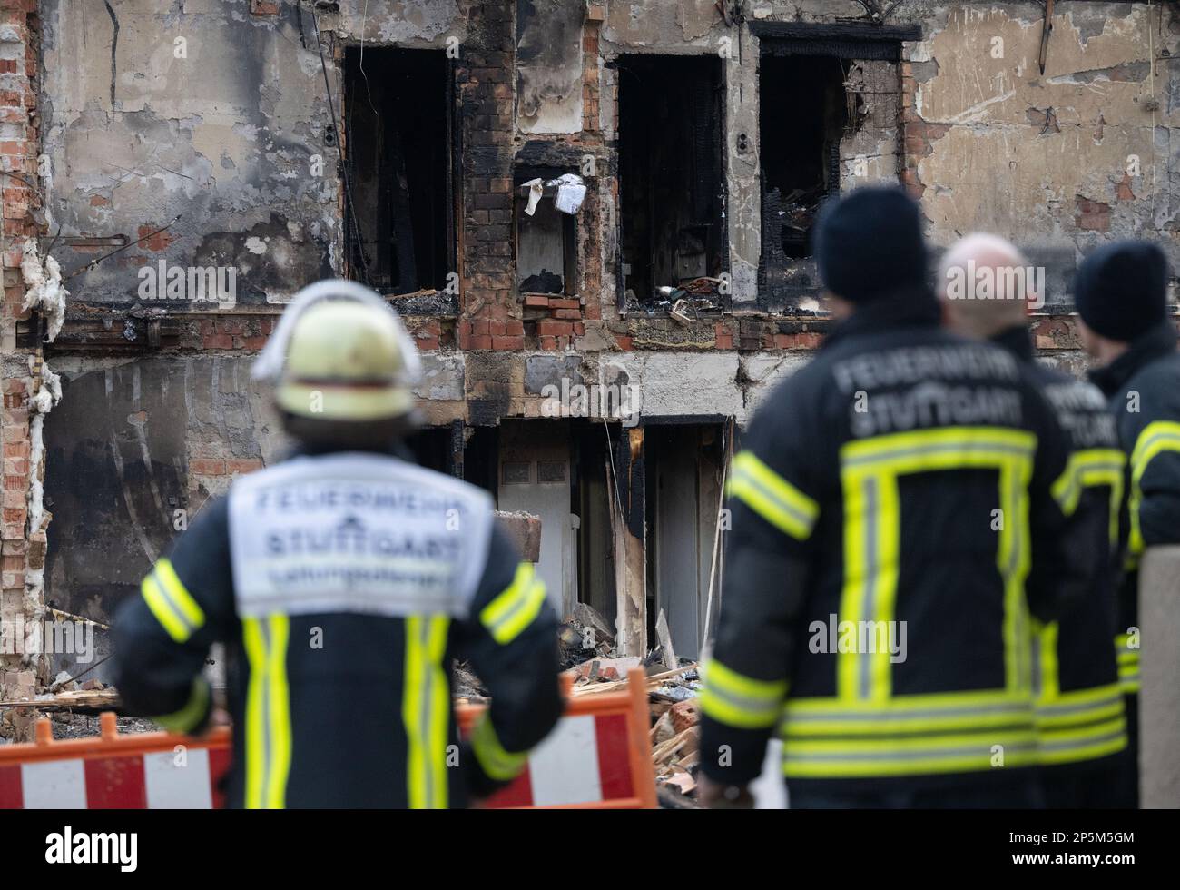 Stuttgart, Germany. 07th Mar, 2023. Firefighters stand by a destroyed ...