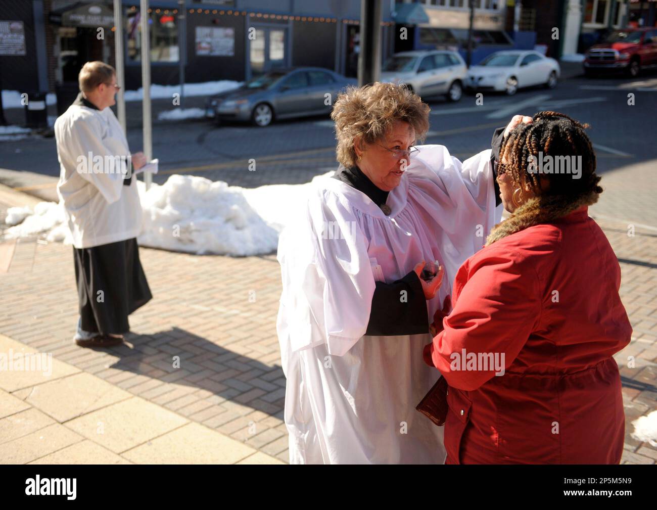 St. James Episcopal Church layperson Grace Barnum administers ashes to ...