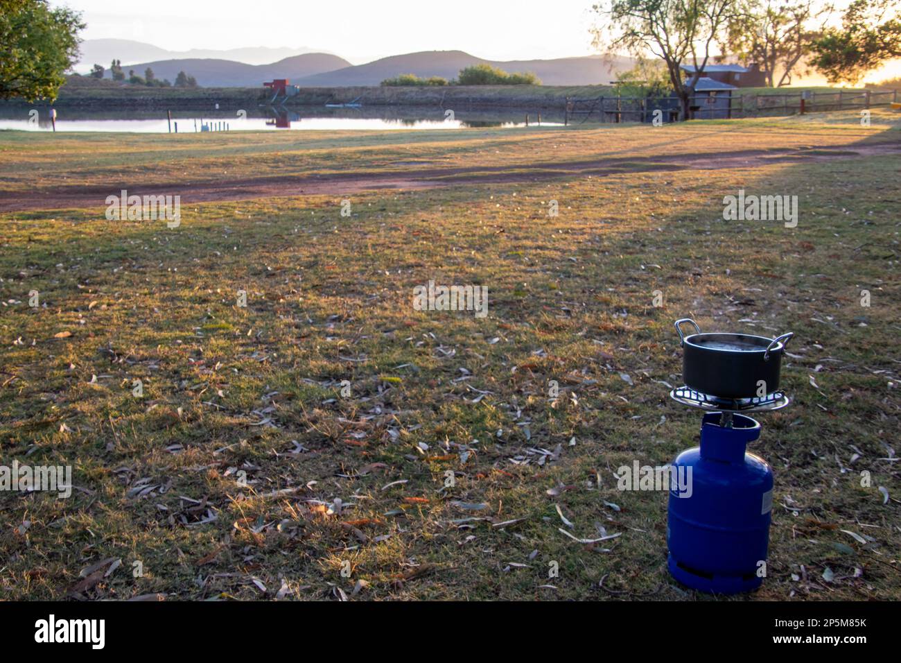 Cooking outdoors on a gas ring stove while out camping Stock Photo - Alamy