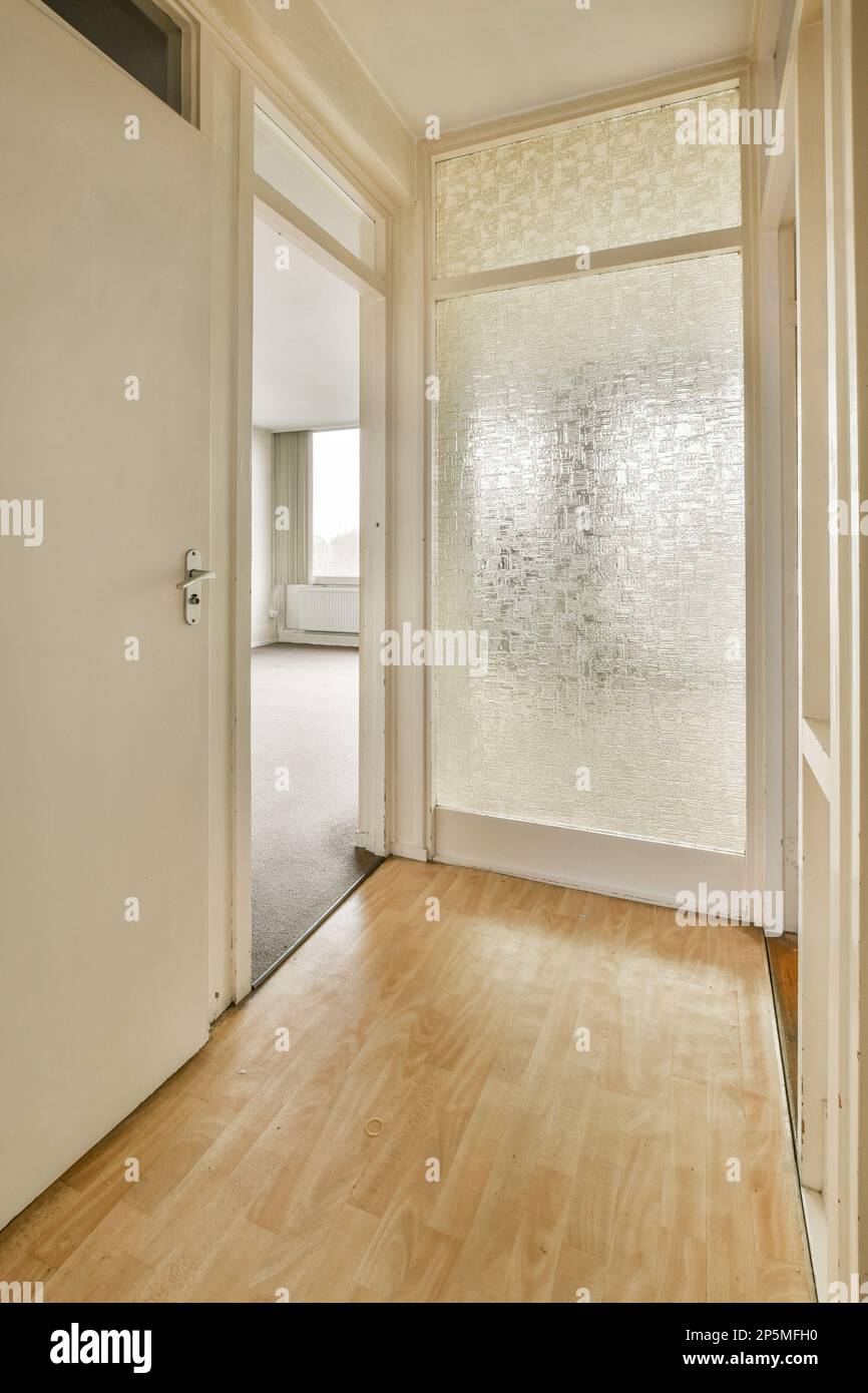 an empty room with wood flooring and white paint on the walls, as if it ...