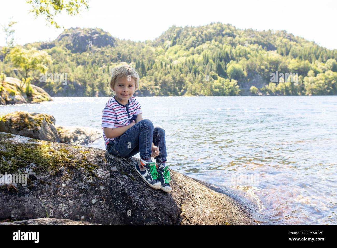 Happy people, enjoying amazing views in South Norway coastline, fjords ...