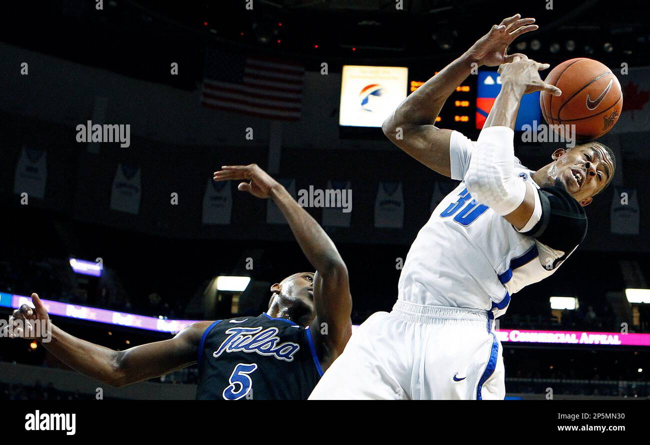 Memphis' D.J. Stephens (30) grabs a rebound in front of Tulsa's Tim ...