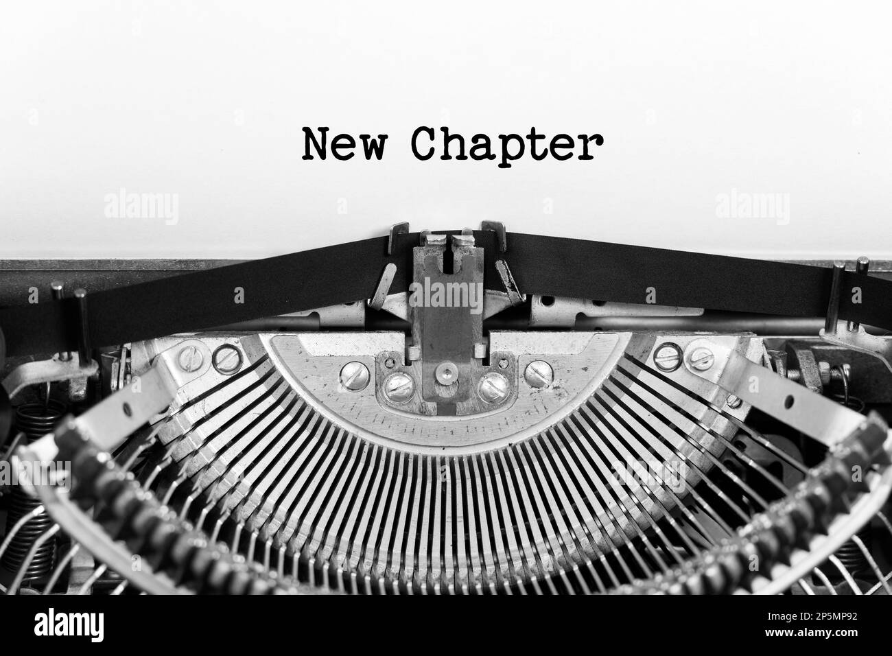 New Chapter phrase close up being typing and centered on a sheet of ...