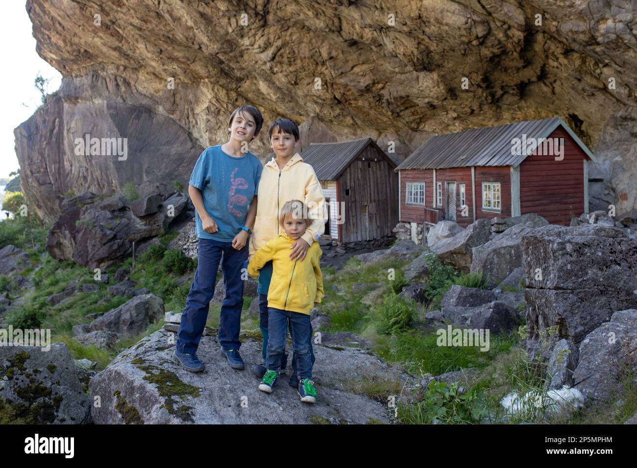 Happy people, enjoying amazing views in South Norway coastline, fjords ...