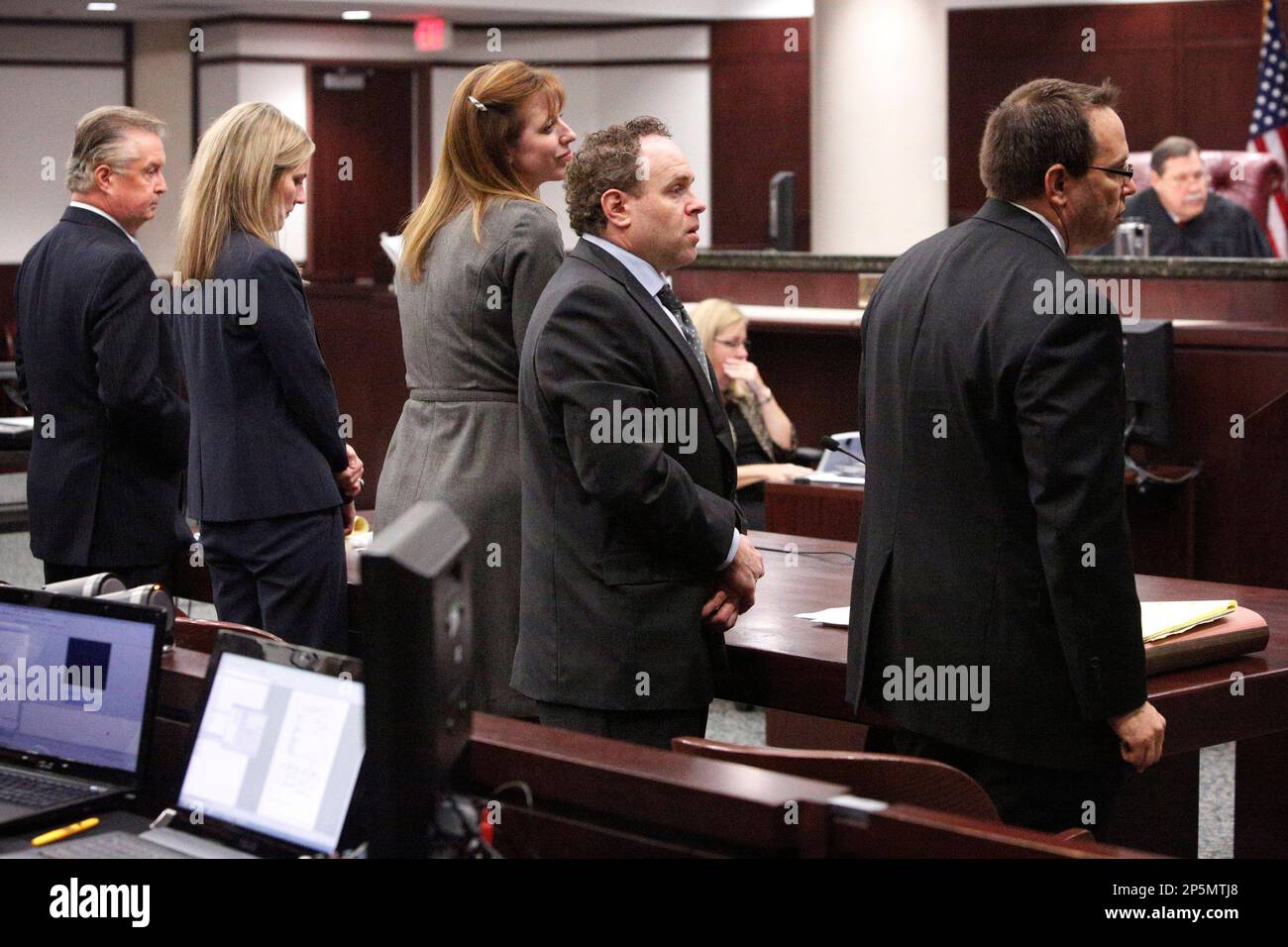 Radio host Todd "MJ" Schnitt, center right, appears in court with his ...