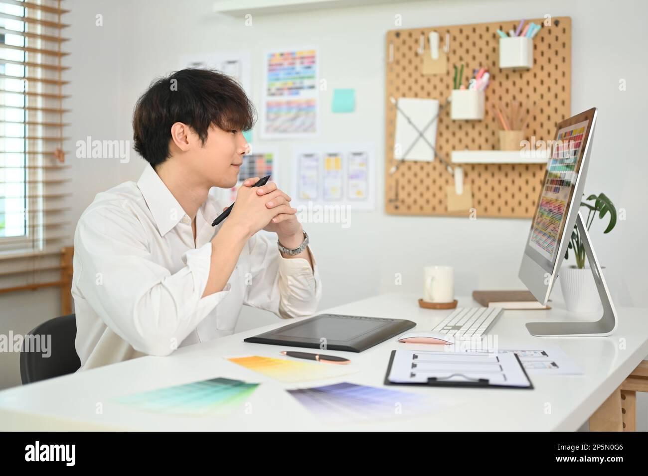 Professional web developer creating website wireframe sketches at ...