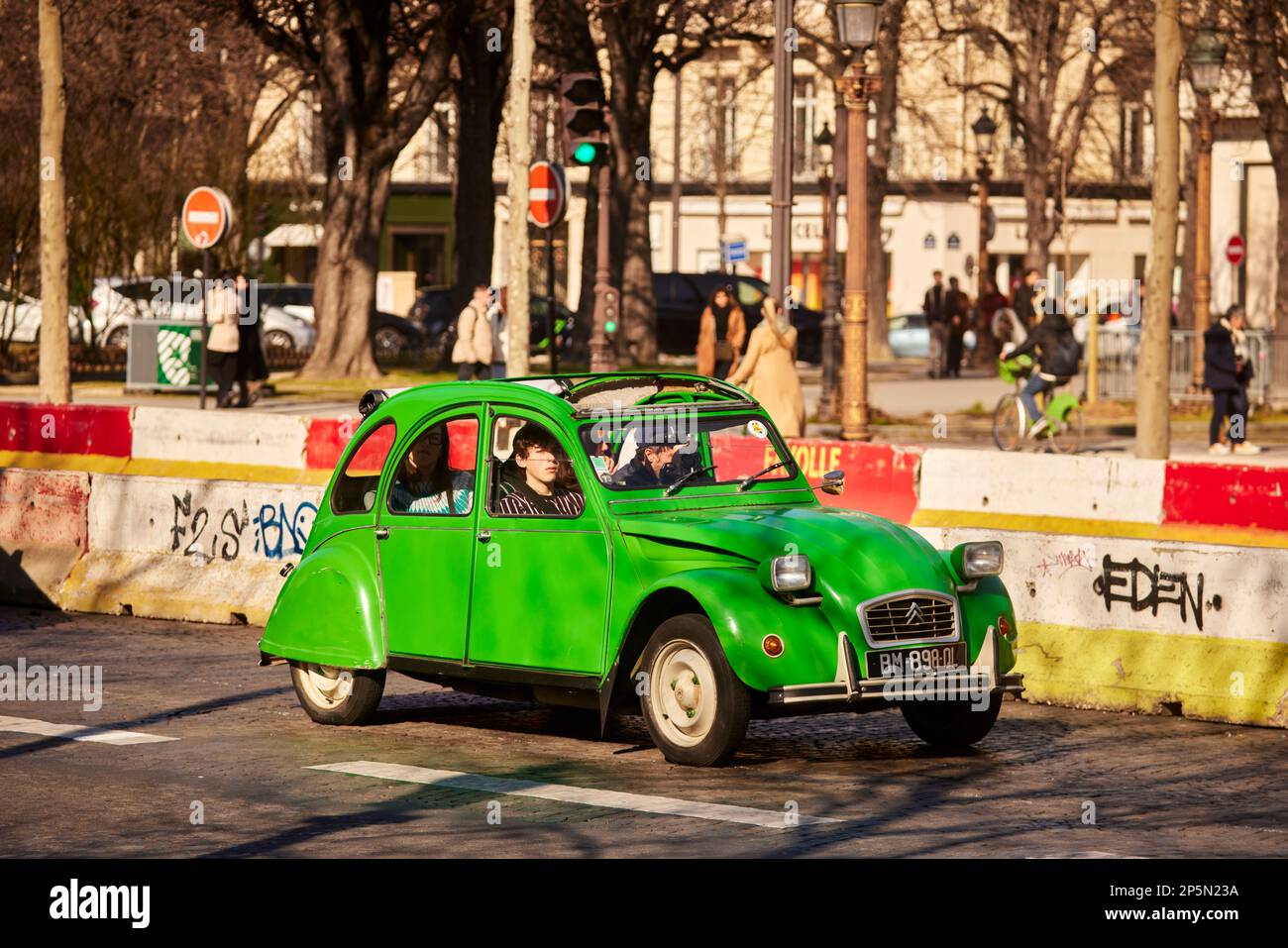 Paris Citroën 2CV sedan with canvas roof rolled back on Champs-Élysées ...