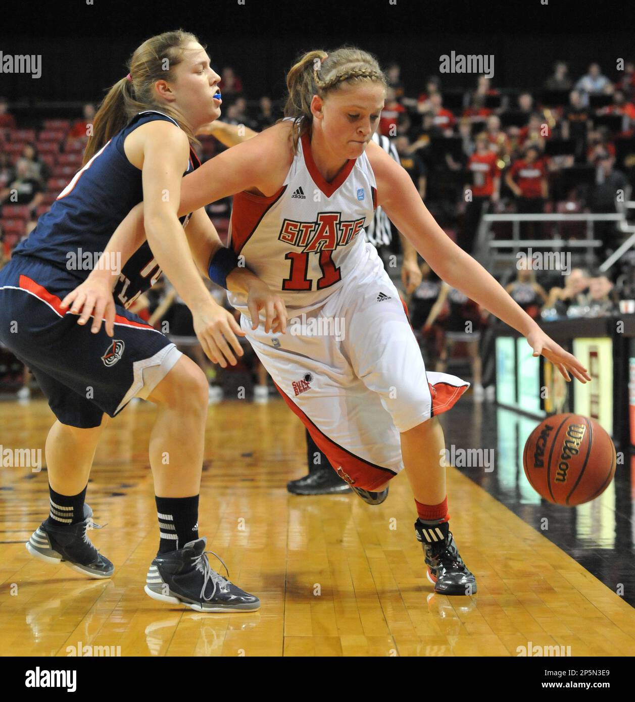 Arkansas State's Jane Morrill (11) fends off Florida Atlantic's ...