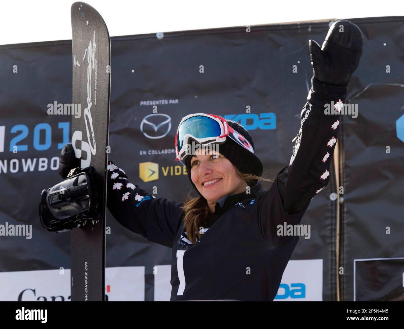 Gold medallist Maelle Ricker, center, of Canada, celebrates on the ...