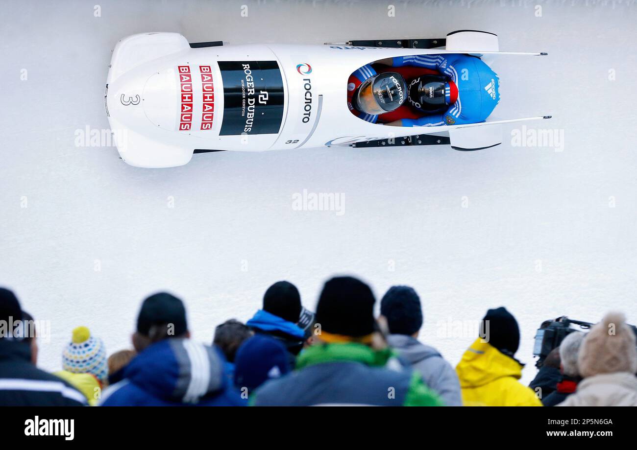 Alexandr Zubkov and Dmitry Turnenkov from Russia speed down the track ...