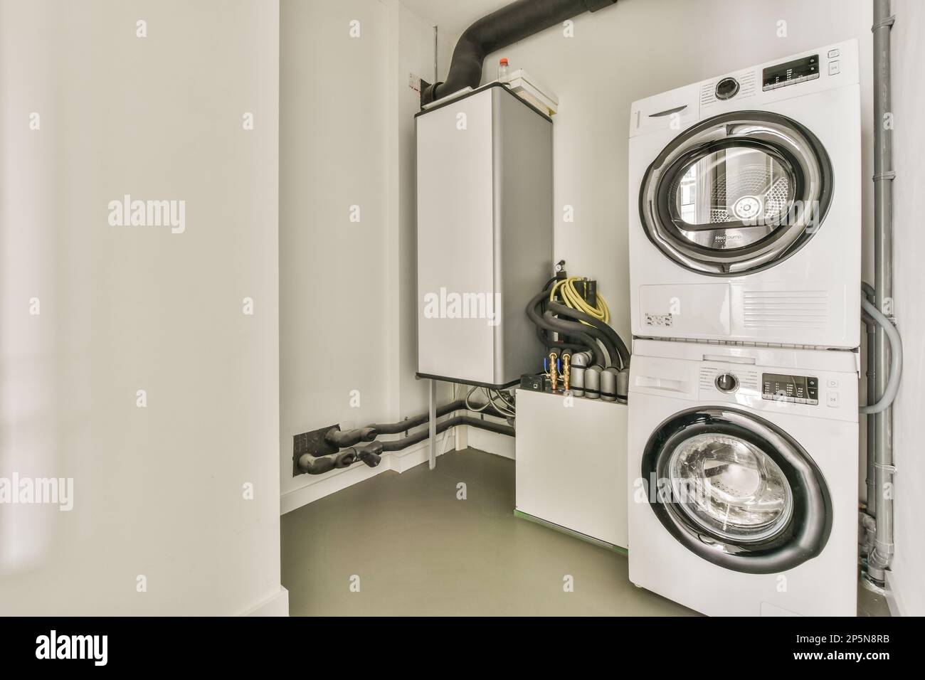 a washer and dryer in a laundry room with the door open to show how it ...