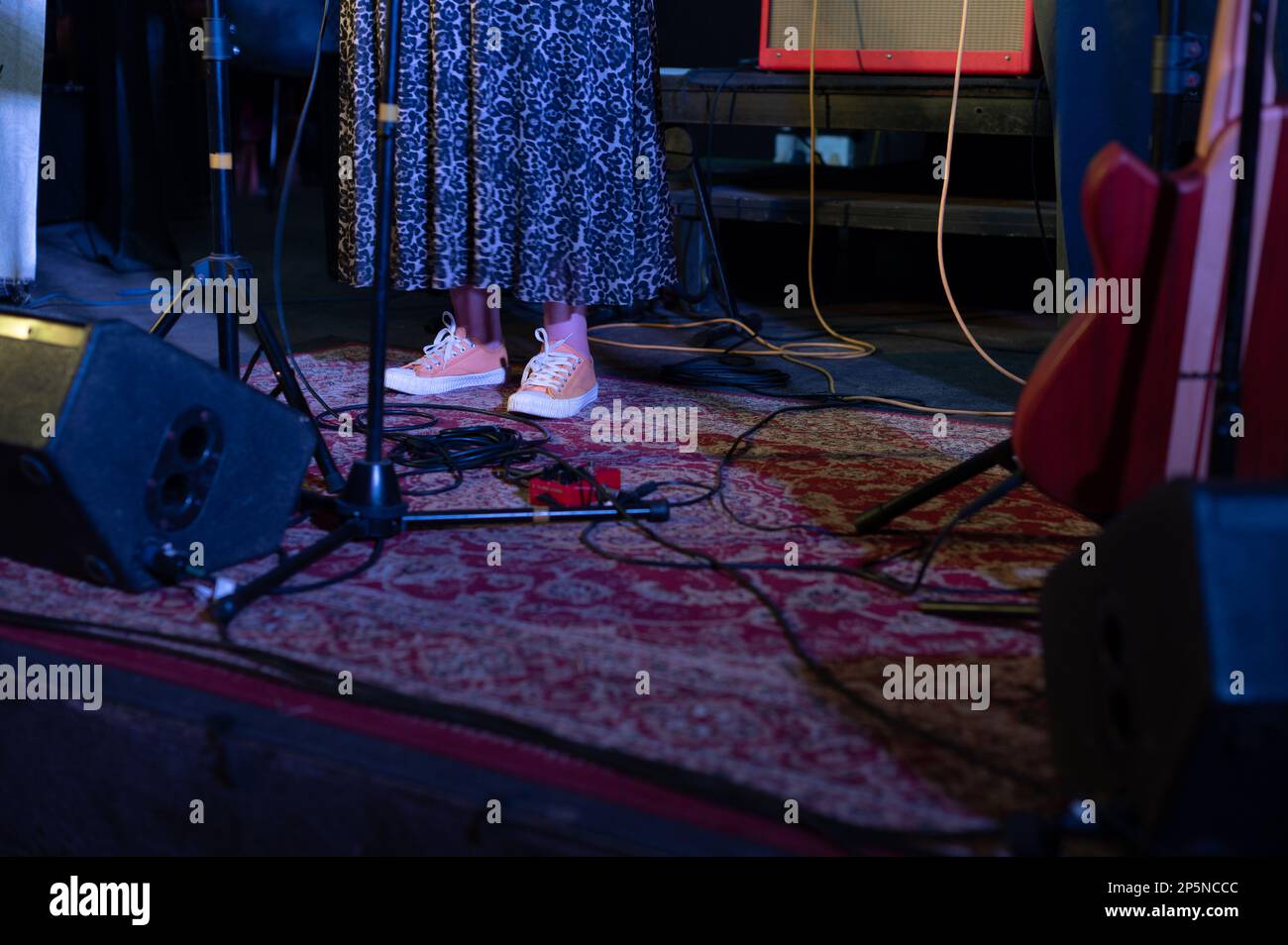 Feet of performer seen on stage Stock Photo - Alamy