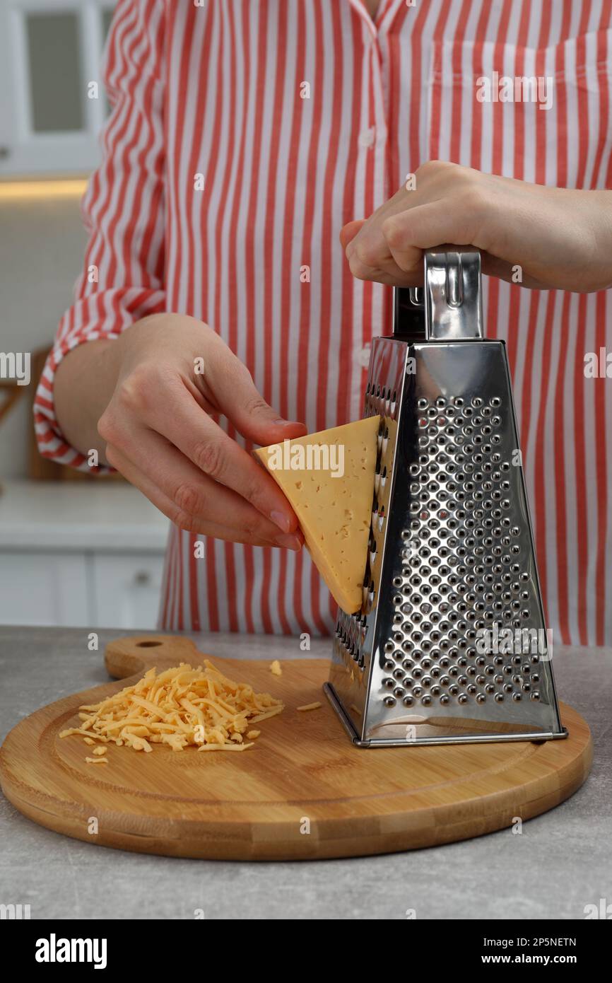 Grating cheese grater hands hi-res stock photography and images - Alamy