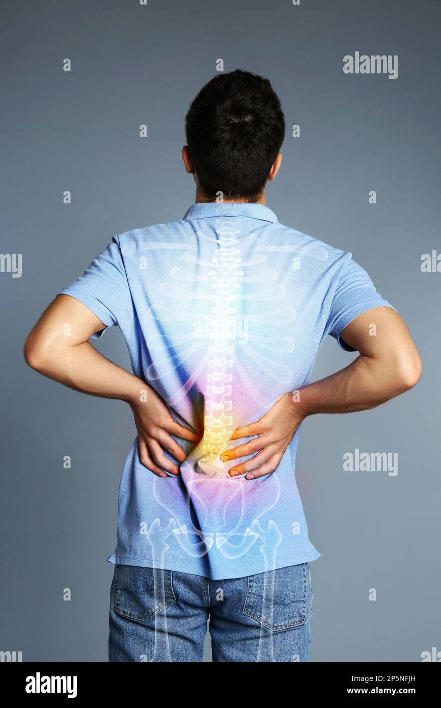 Man having backache digital compositing with illustration of spine hi ...