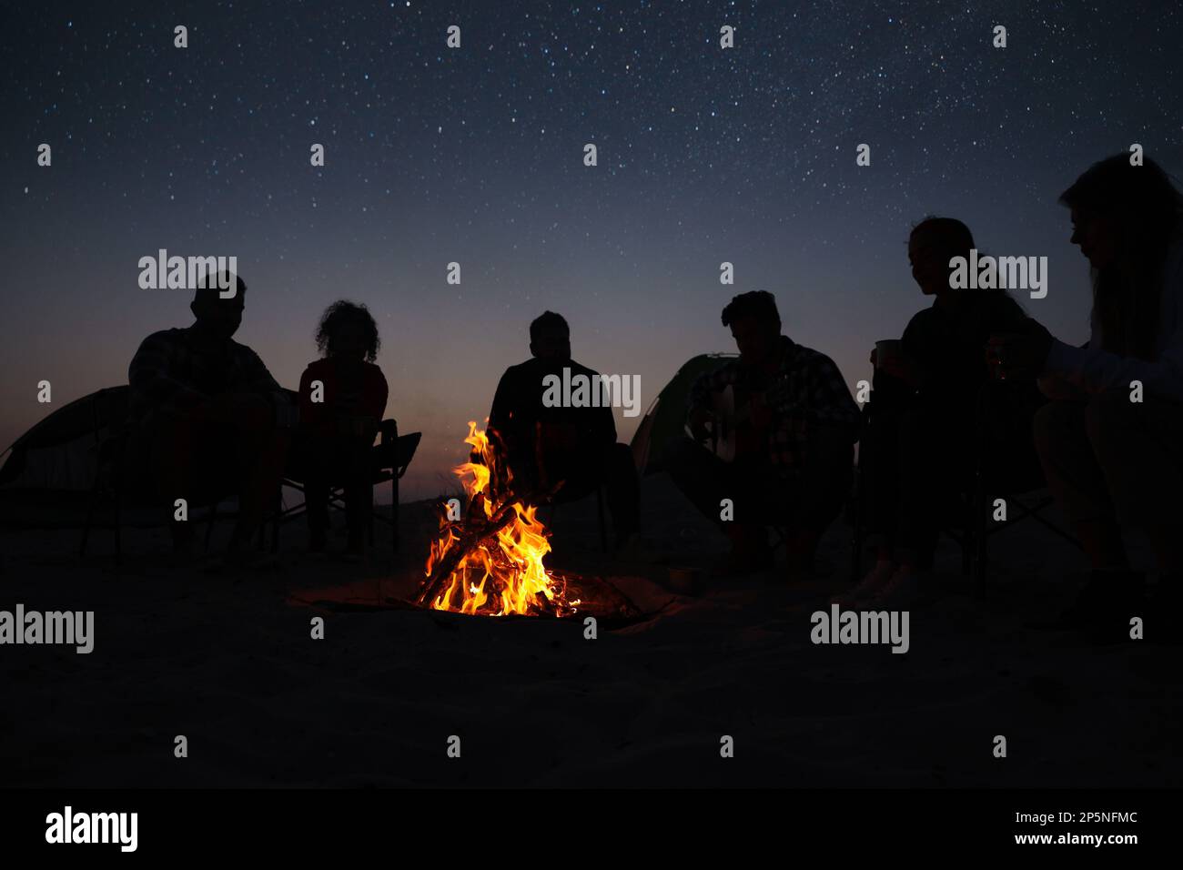 Gathering around fireplace hi-res stock photography and images - Alamy