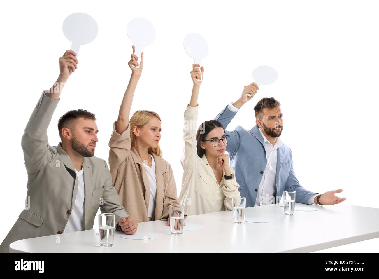 Panel of disappointed judges holding blank score signs at table on ...