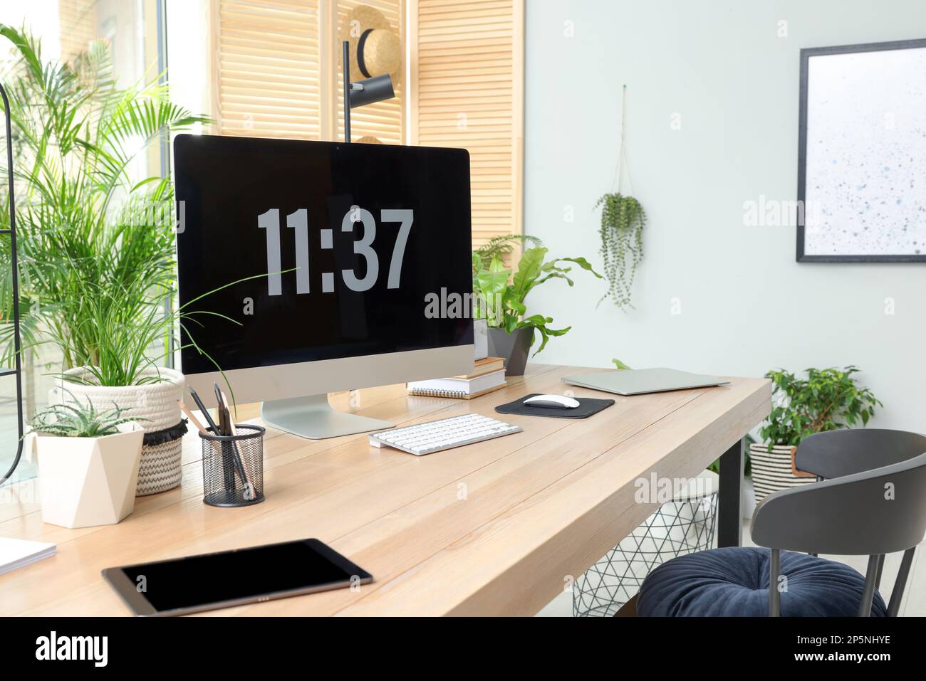 Comfortable workplace with computer in light room. Interior design ...