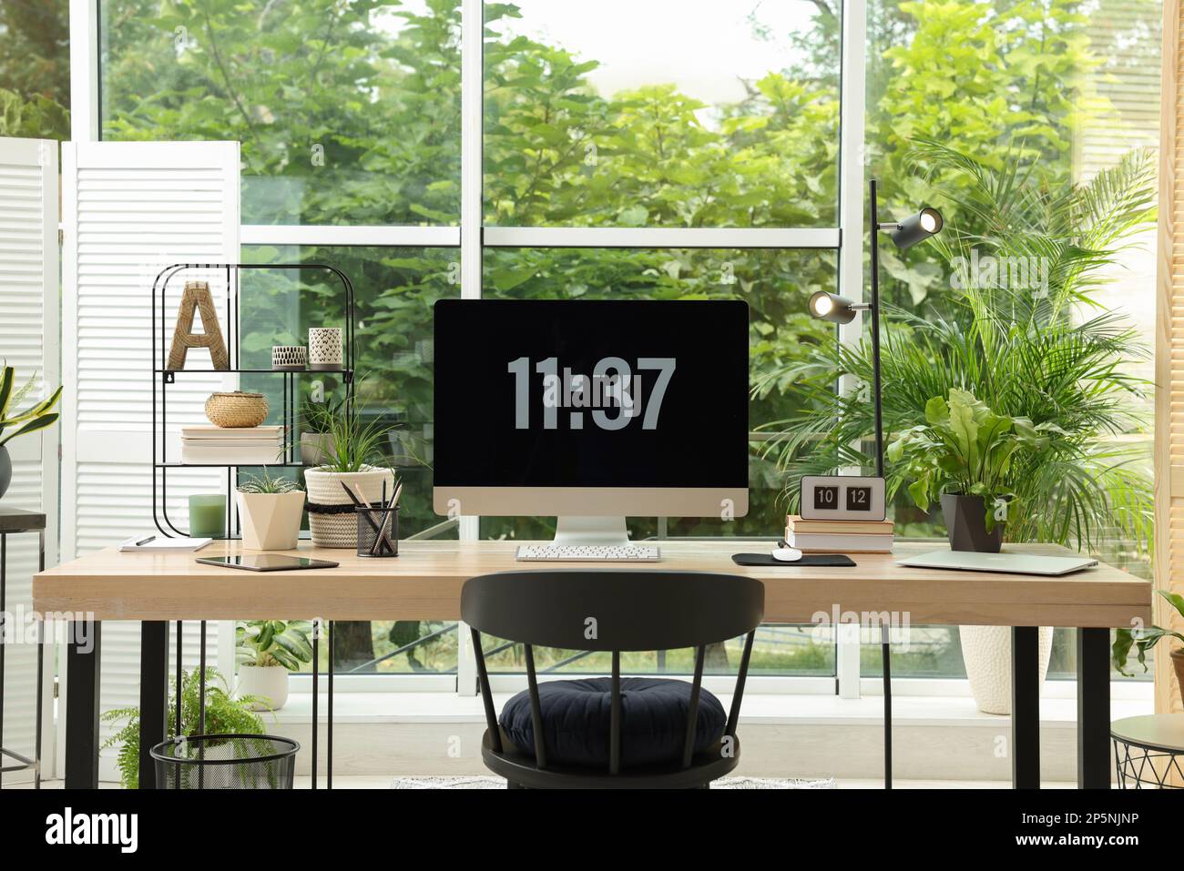 Comfortable workplace with computer in light room. Interior design ...