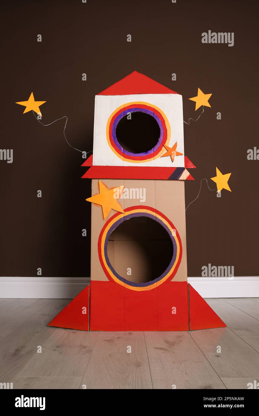 Cute handmade cardboard spaceship near brown wall Stock Photo - Alamy