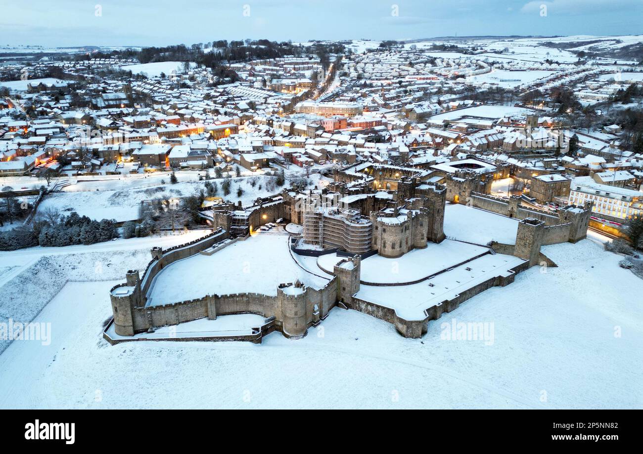 Snow covered fields surround Alnwick Castle in Northumberland as ...