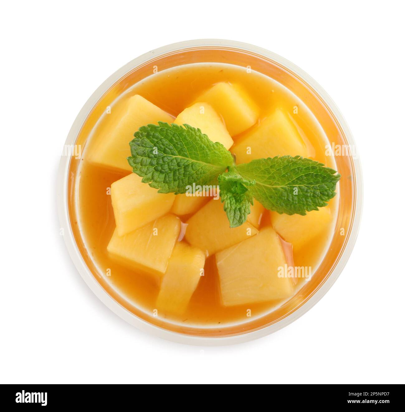 Delicious mango jelly with fresh fruit pieces and mint isolated on ...