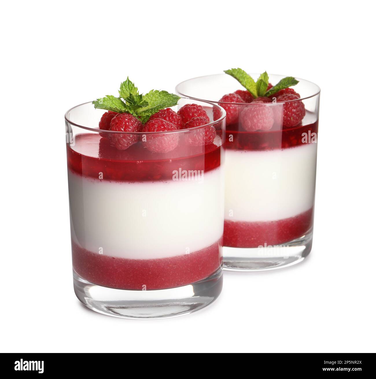Delicious panna cotta with raspberry coulis and fresh berries on white ...