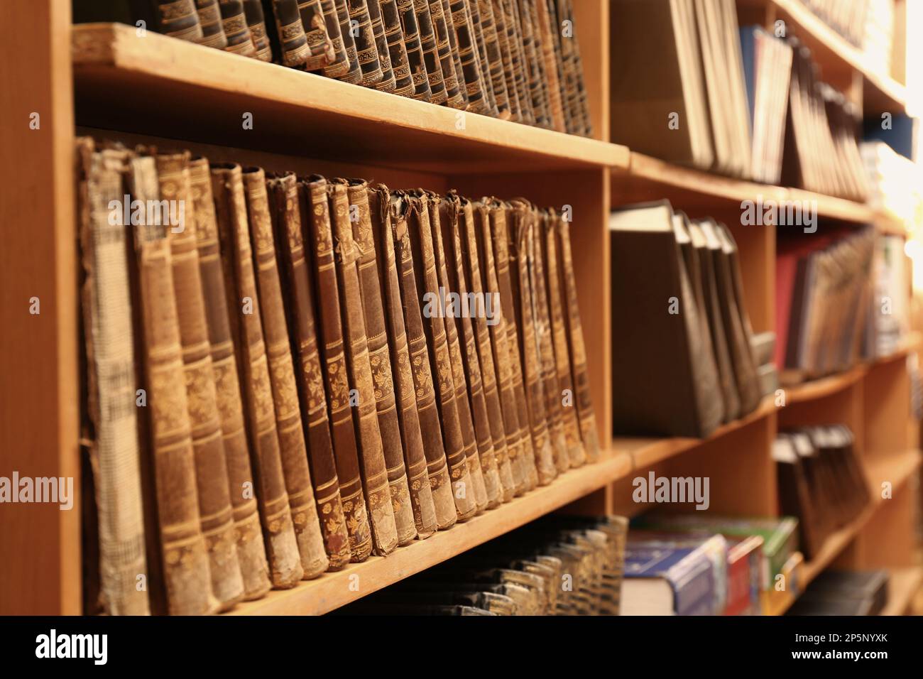 Collection of old books on shelves in library Stock Photo - Alamy