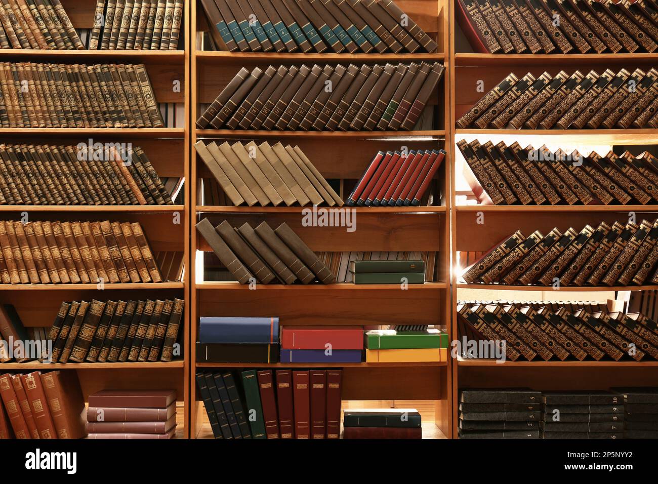 Collection of different books on shelves in library Stock Photo - Alamy