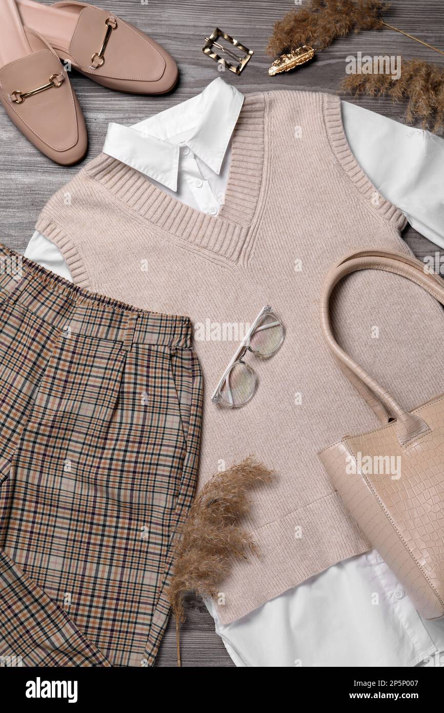 Fall fashion. Layout with women's outfit on wooden background, top view ...