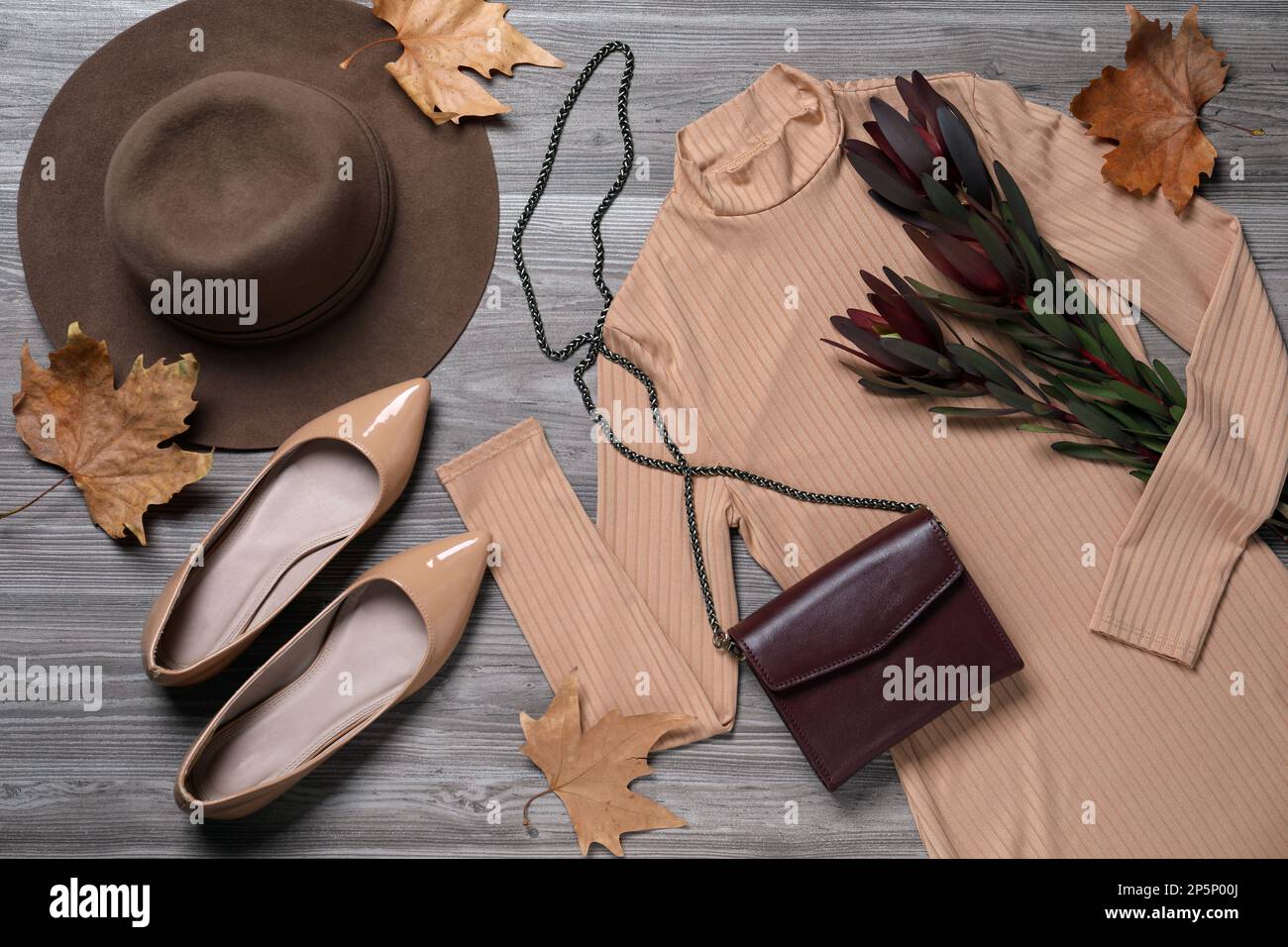 Fall fashion. Layout of women's outfit on wooden background, top view ...
