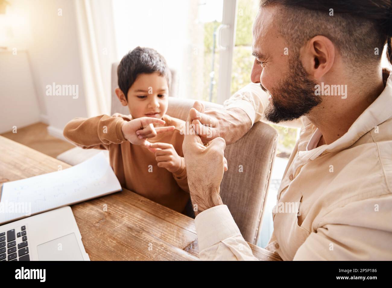 Learning, education and father with kid for sign language in home for ...