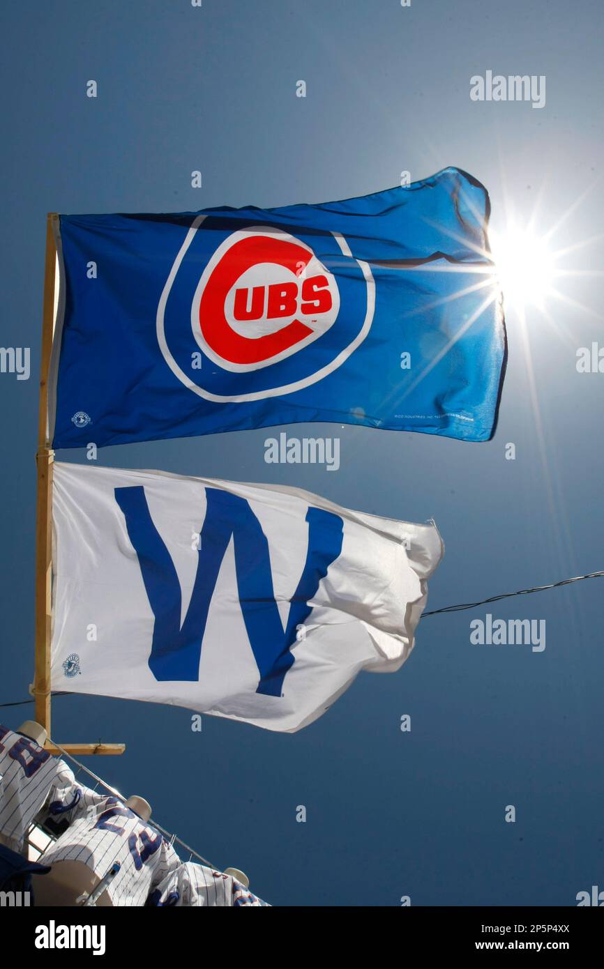 CHICAGO, IL- MAY 14: A Chicago Cubs flags and a large W flag indicating ...