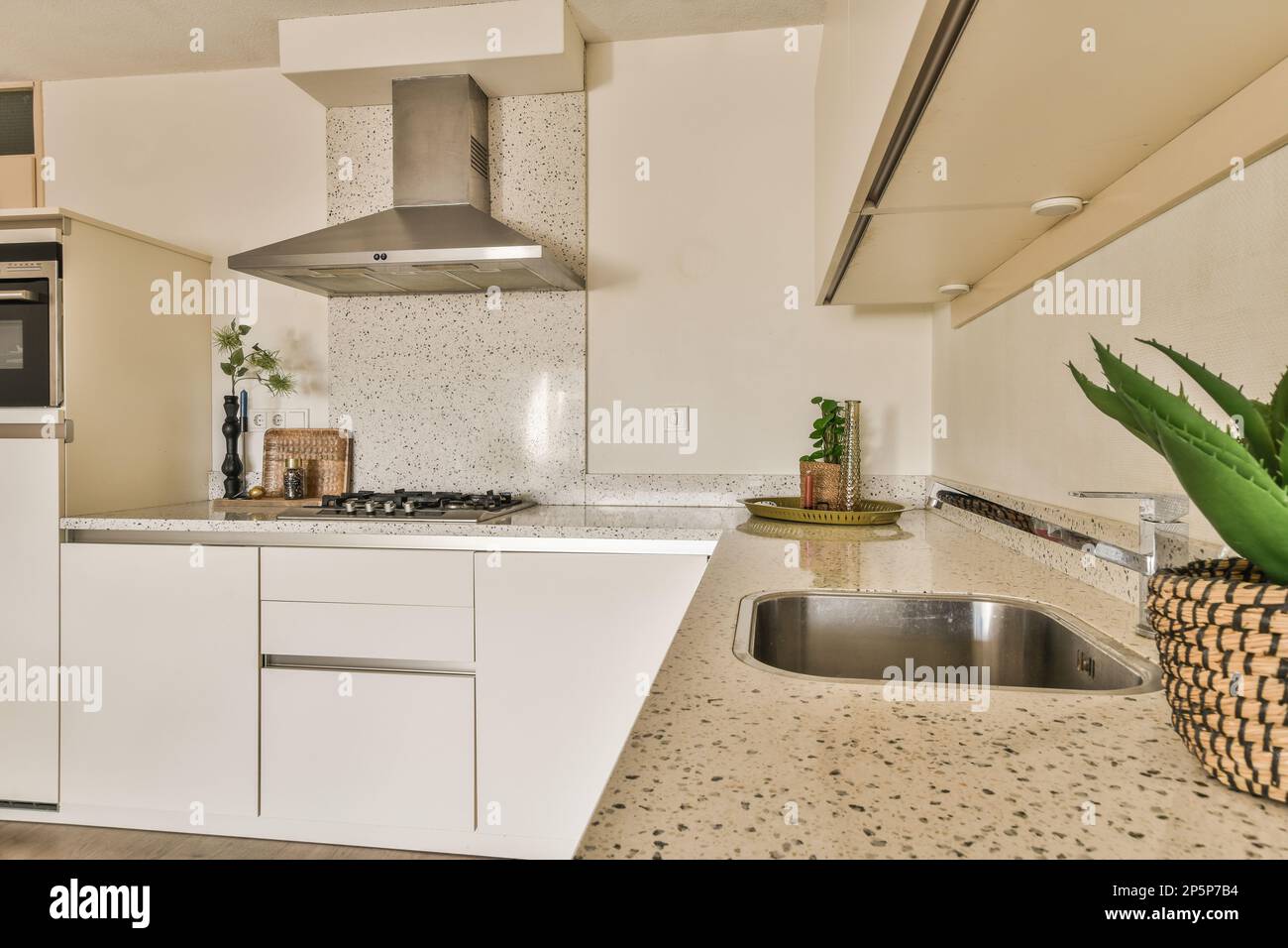 a modern kitchen with granite counter tops and white cabinets in the ...