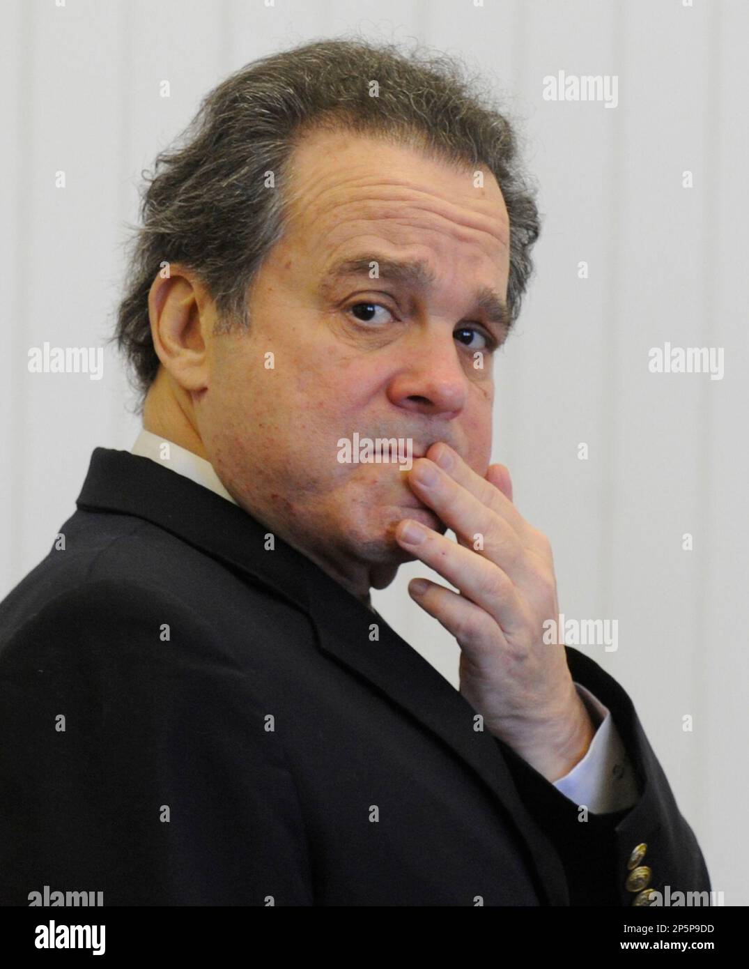 Bruce Cole, former CEO of Mamtek US Inc., looks at reporters today as ...