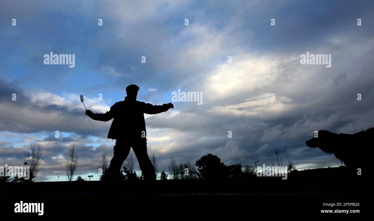 James Hosford of Bremerton plays fetch with his dog Titan at the boat ...