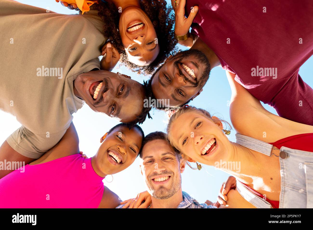 Portrait happy diverse friends embracing hi-res stock photography and ...