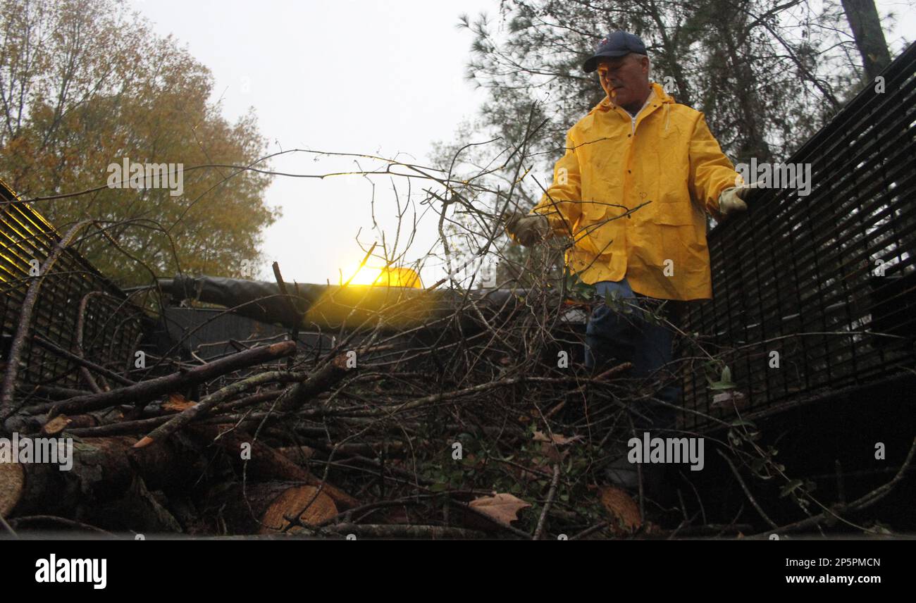 Rick LeRoy, with Harris County Road and Bridge Maintenance, tosses ...