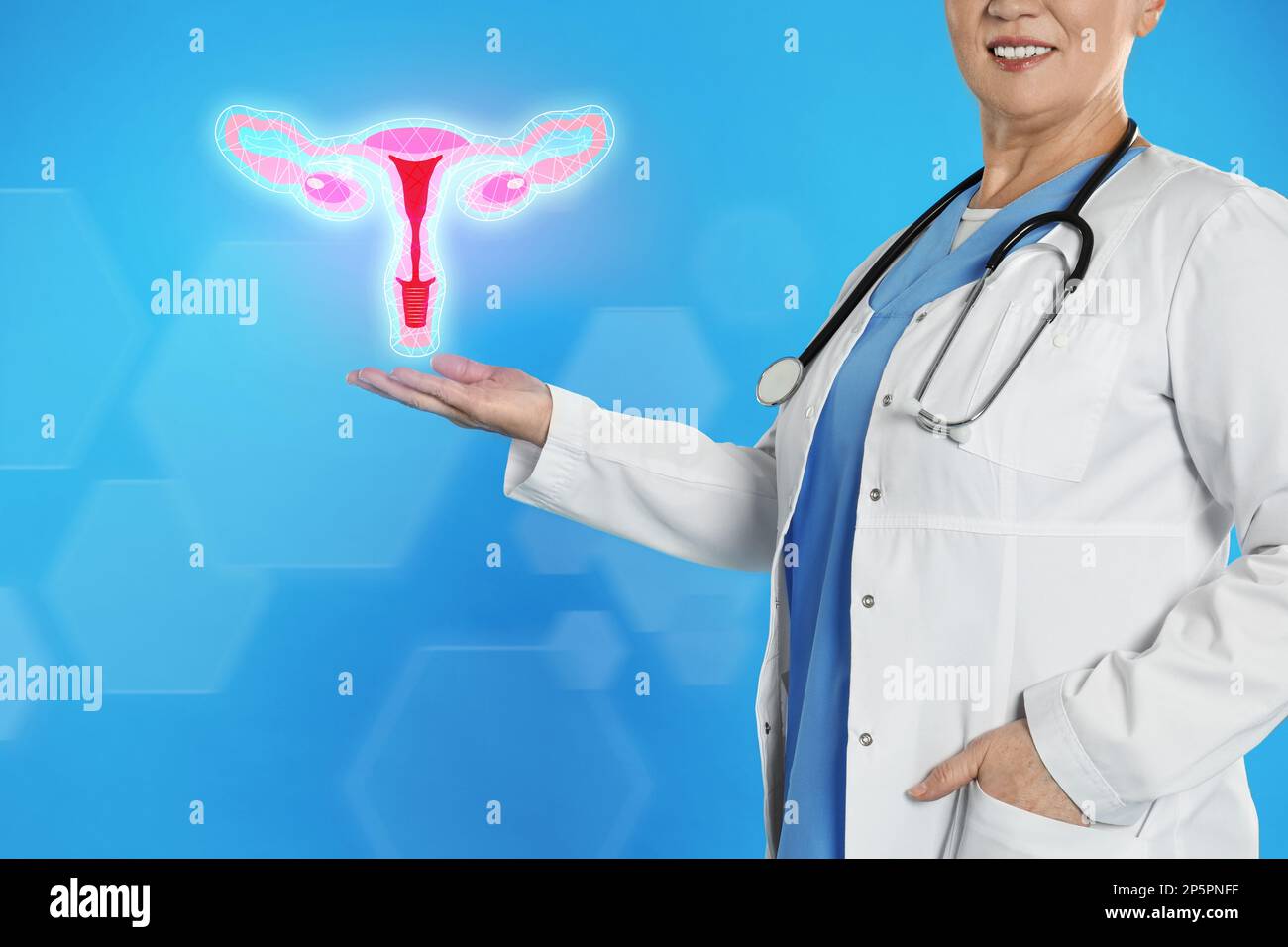 Mature doctor demonstrating virtual icon with illustration of female ...