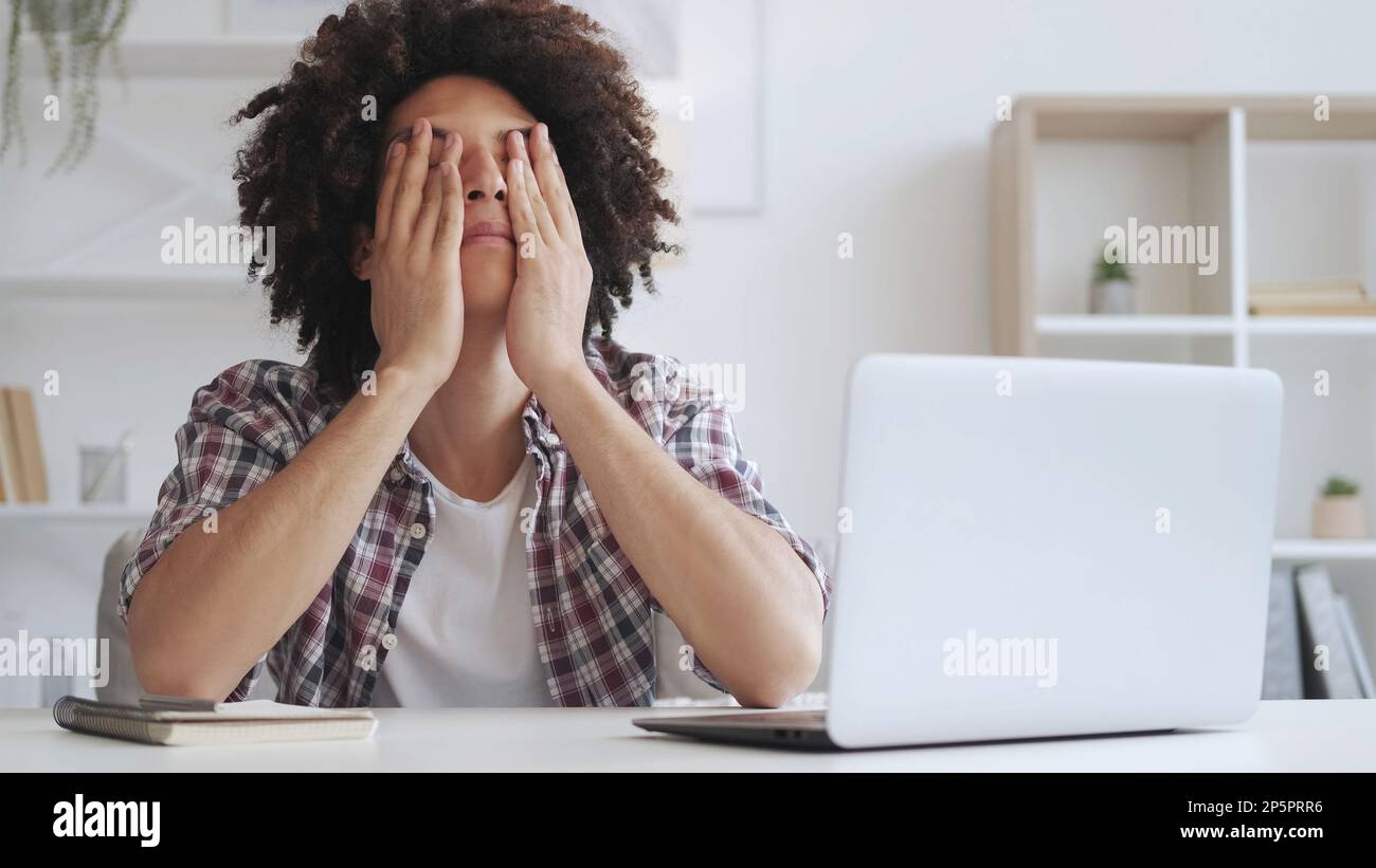 Tired student eyestrain fatigue computer break Stock Photo - Alamy