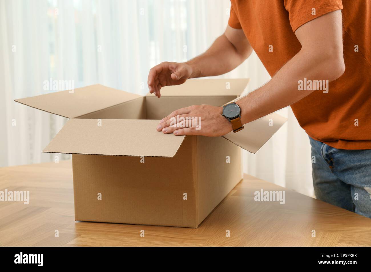 Opening parcel hi-res stock photography and images - Alamy
