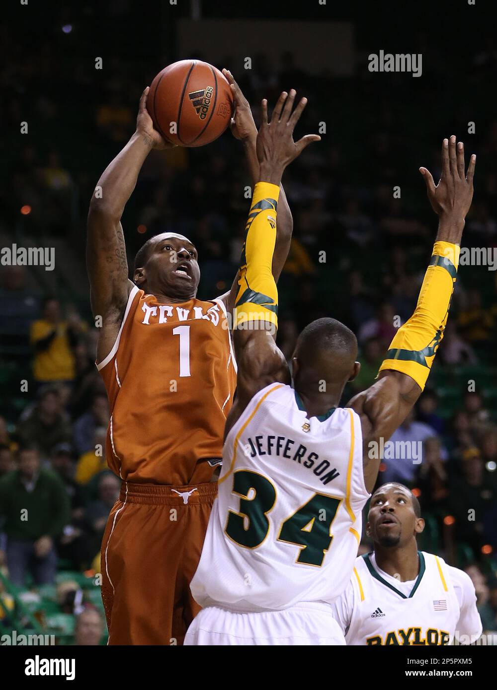 Texas' Sheldon McClellan (1) shoots over Baylor's Cory Jefferson (34 ...