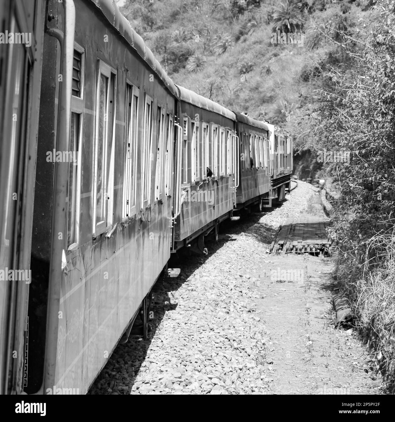 Toy Train moving on mountain slopes, beautiful view, one side mountain ...