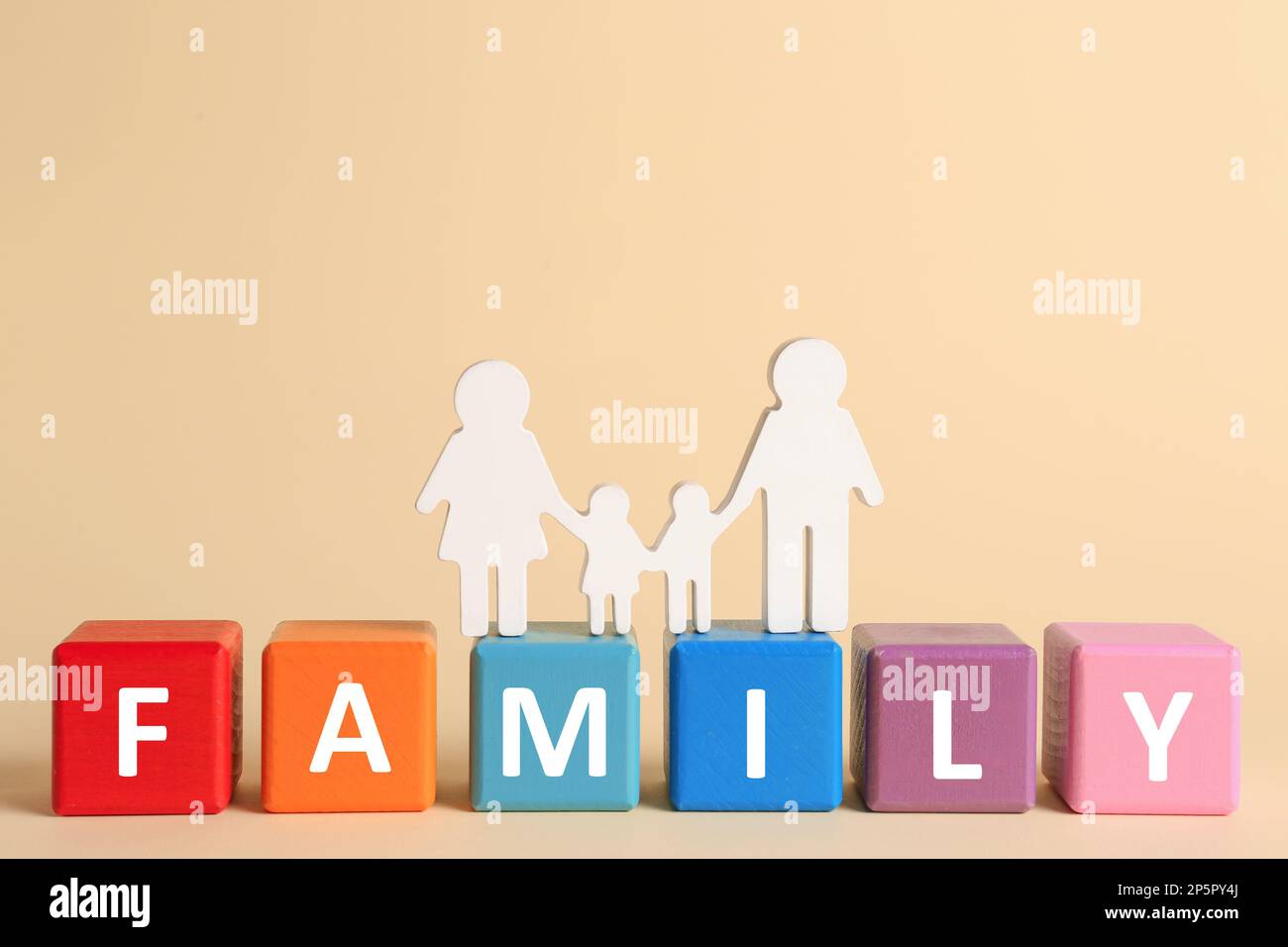 Figure and word Family made of colorful cubes with letters on pale ...