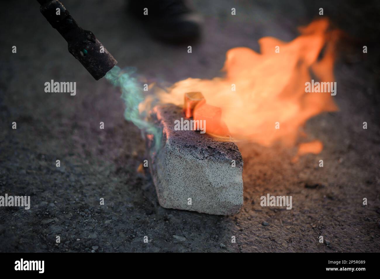 Coal on fire. Ignition of square coal with a gas burner Stock Photo - Alamy