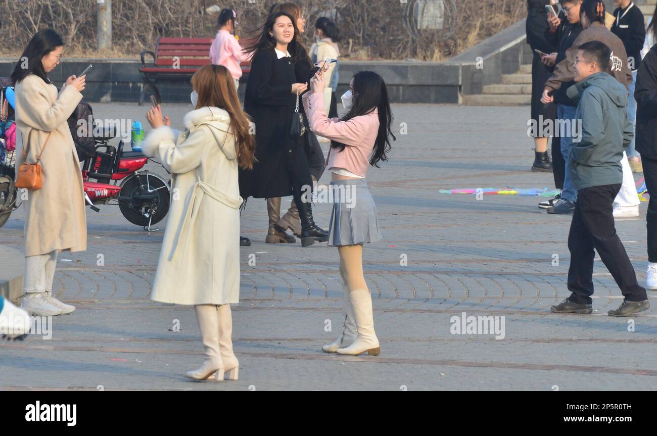 People go out in spring clothes as the highest temperature reaches to ...