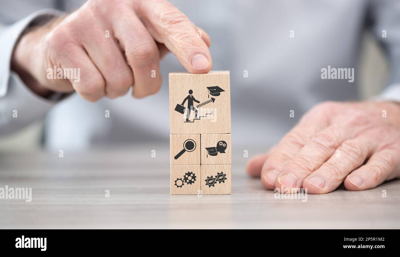 Wooden blocks with symbol of continuing education concept Stock Photo ...