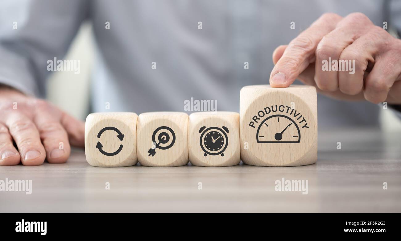 Wooden blocks with symbol of productivity concept Stock Photo - Alamy