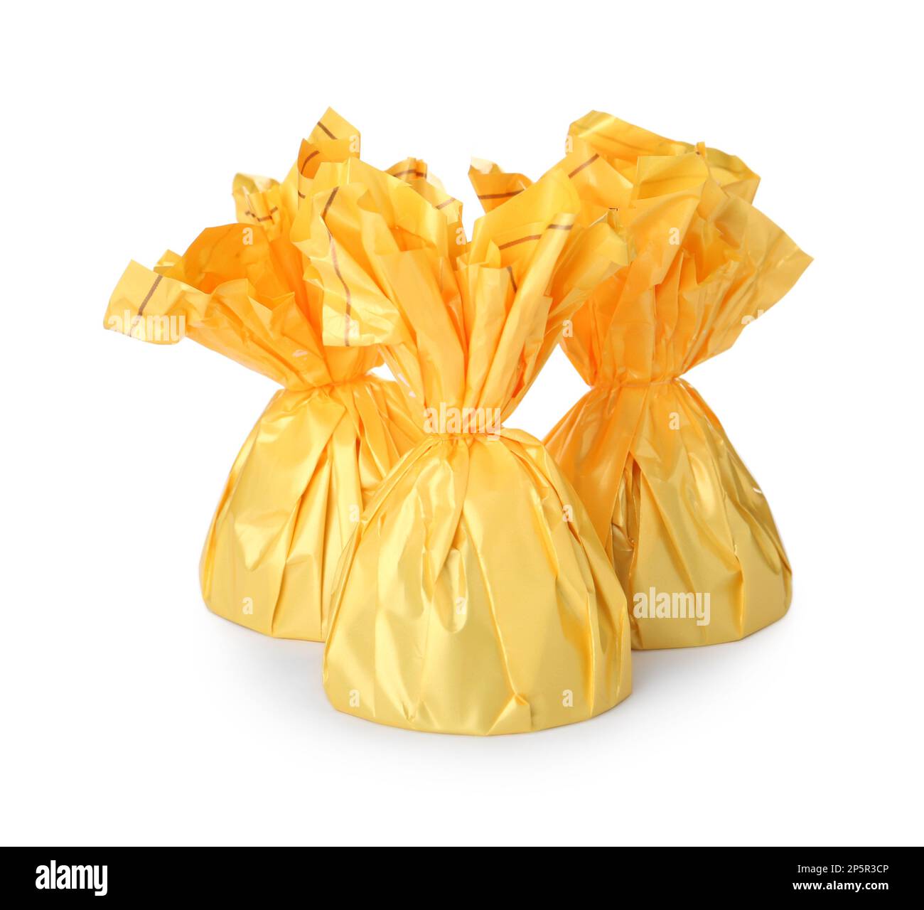 Delicious candies in yellow wrappers on white background Stock Photo ...